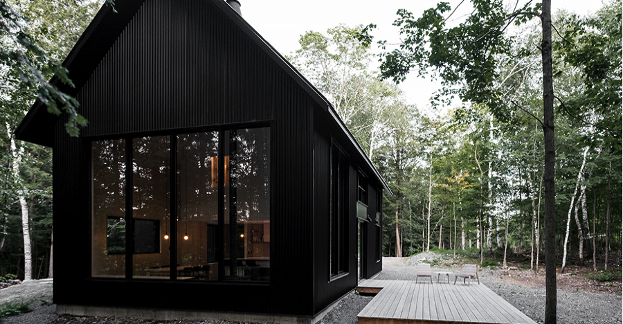 A Black Metal Cottage in Quebec With a Stunning Interior