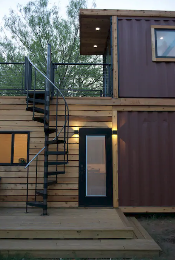 A Stacked Container Home With A Rooftop Patio