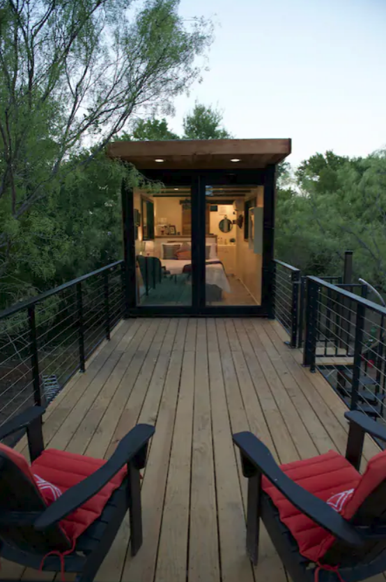 A Stacked Container Home With A Rooftop Patio