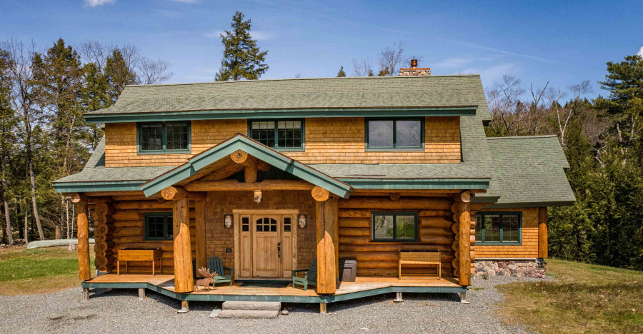 See This Stunning 3 Bedroom Log Home With a Large Rear Deck