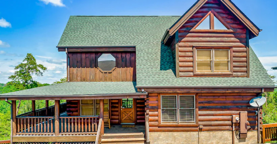 This Hilltop Log Cabin Perched Over the Glorious Smoky Mountains
