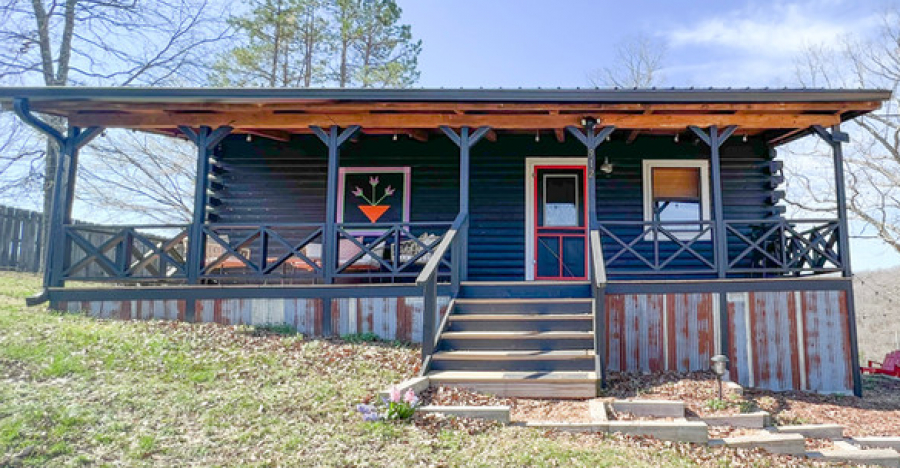 Get Cozy in This Updated Log Cabin with Firepit!